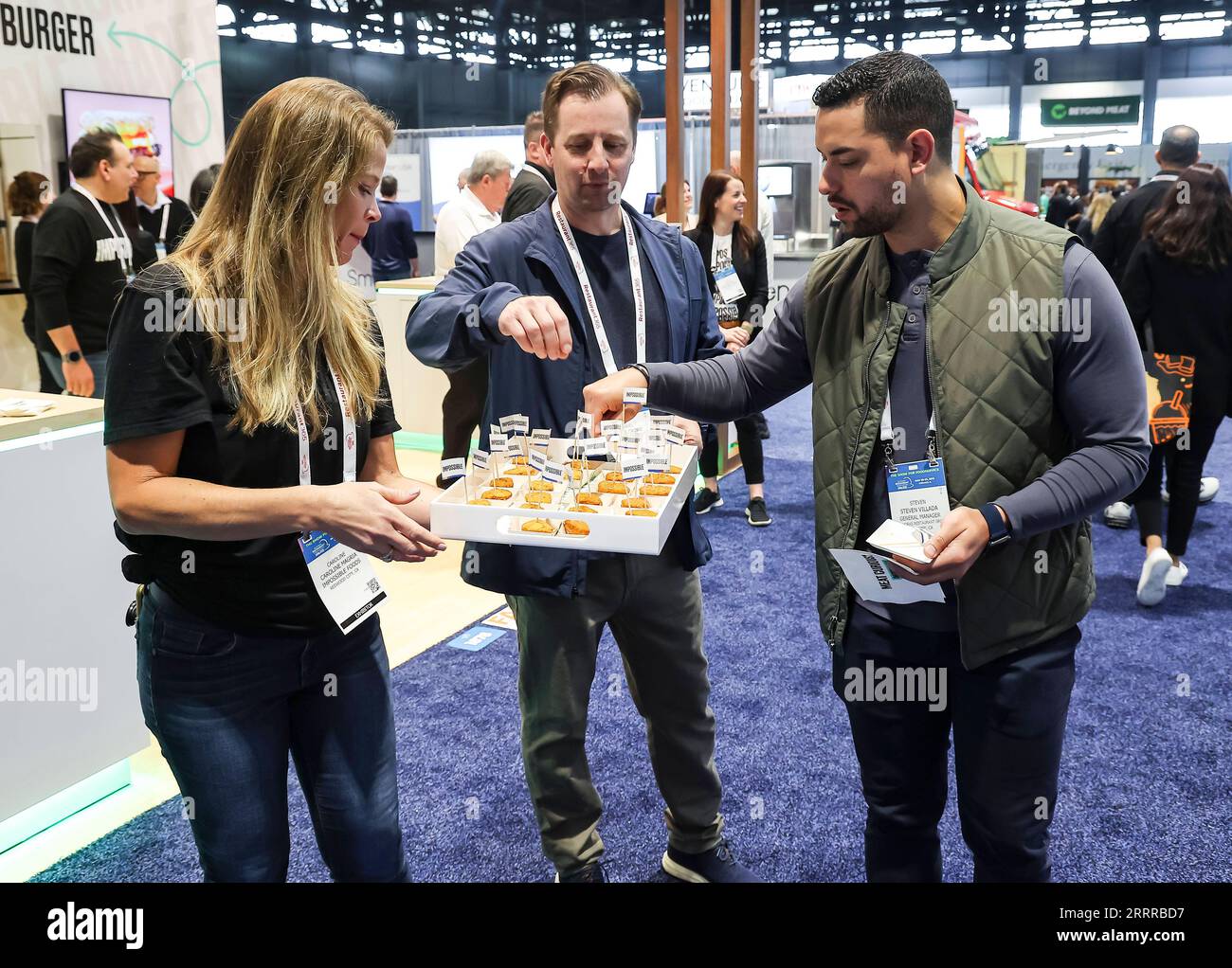 230521 -- CHICAGO, May 21, 2023 -- Visitors sample food during the 2023 ...