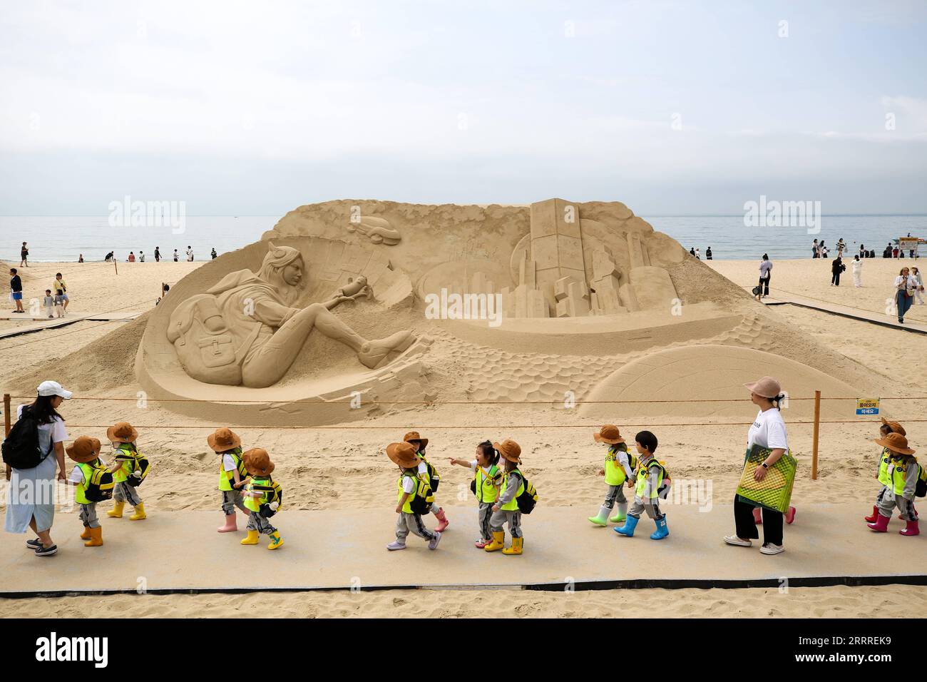 230526 -- BUSAN, May 26, 2023 -- Tourists view a sand sculpture at ...