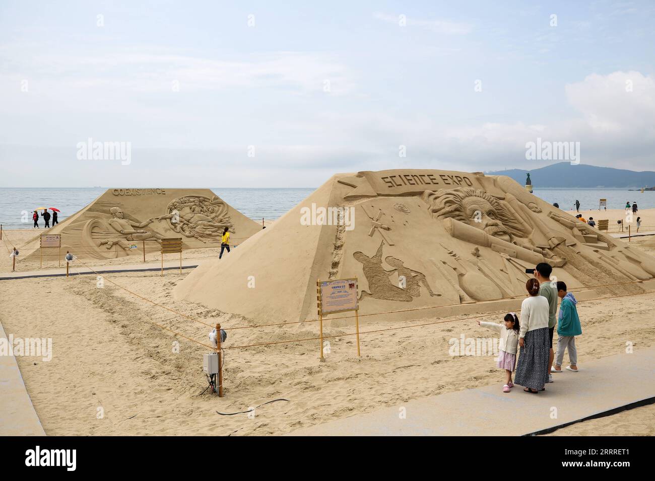 230526 -- BUSAN, May 26, 2023 -- Tourists view a sand sculpture at ...