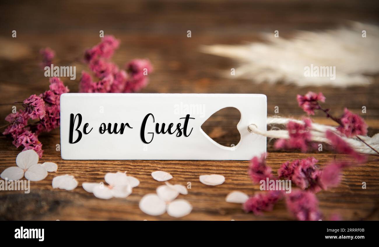 Natural Background With Label With Be Our Guest Stock Photo - Alamy