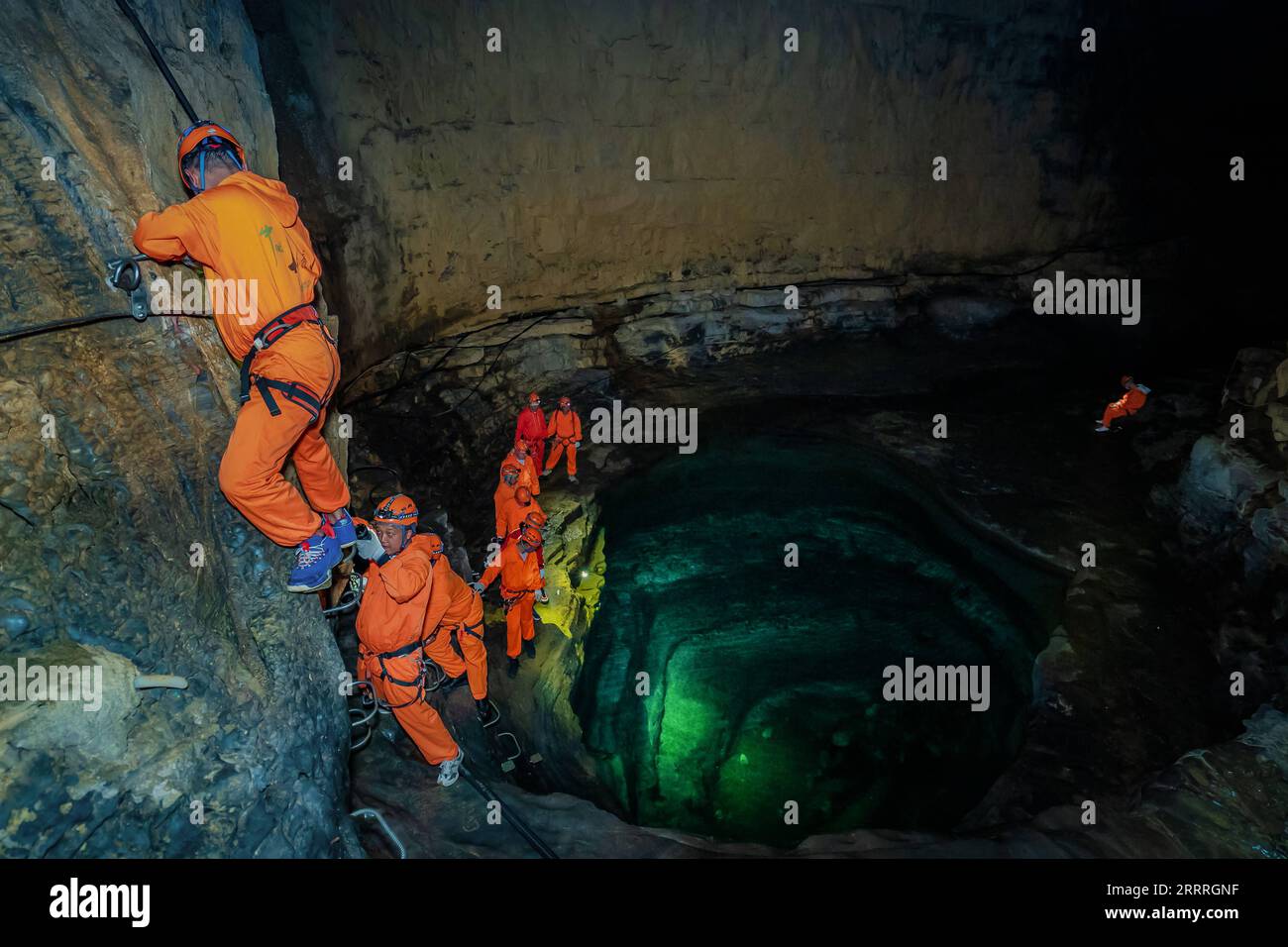 230528 -- GUIYANG, May 28, 2023 -- Tourists explore a karst cave in ...