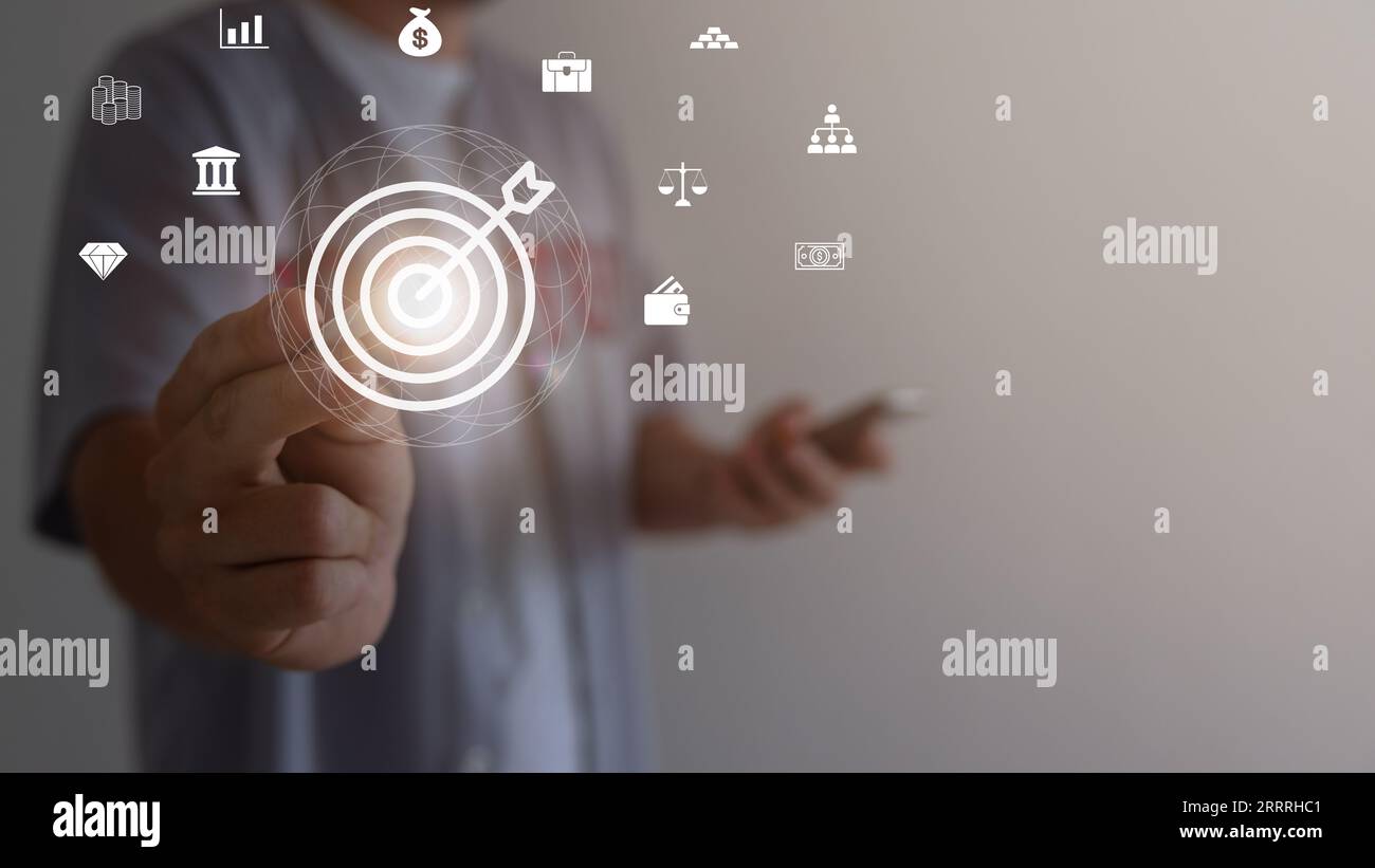 Digital marketing. Businessman touching darts aiming at the target ...