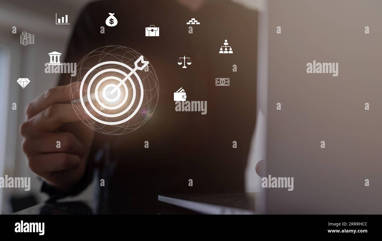 Digital marketing. Businessman touching darts aiming at the target ...