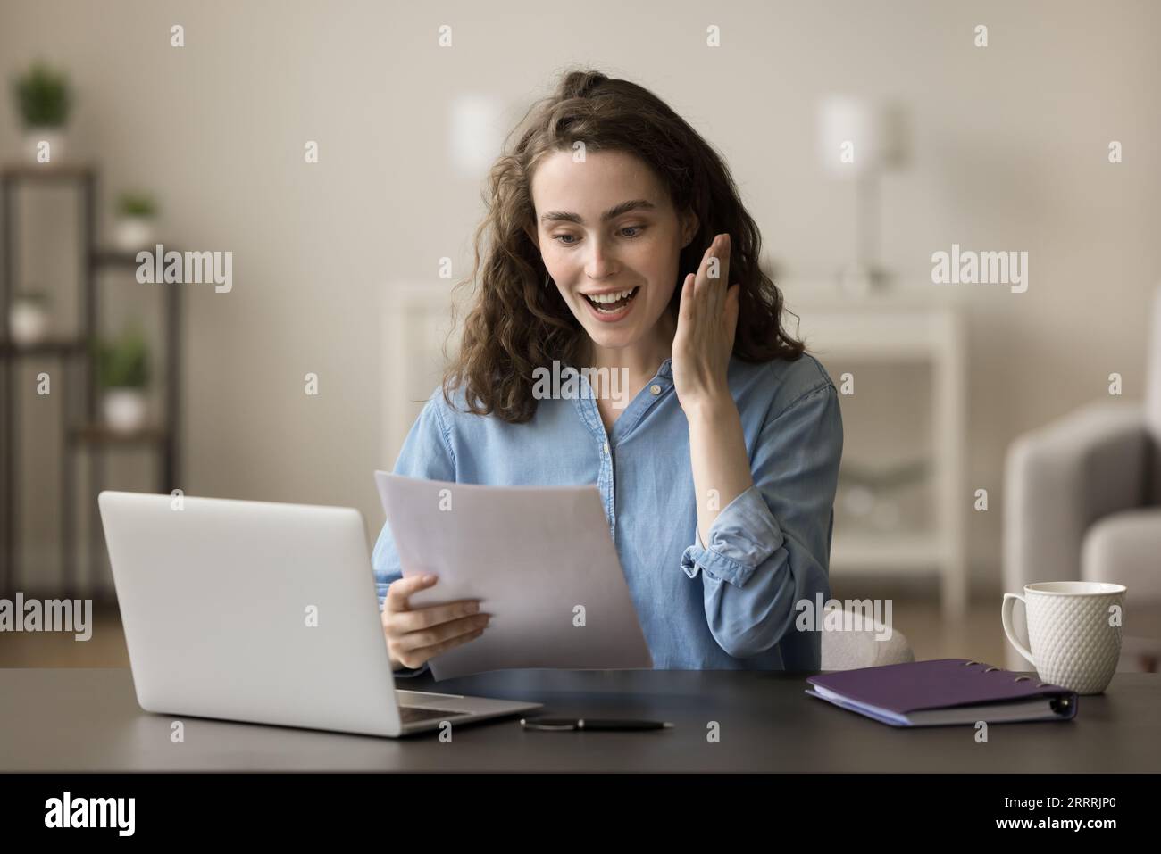 Happy freelance business woman celebrating project success Stock Photo ...
