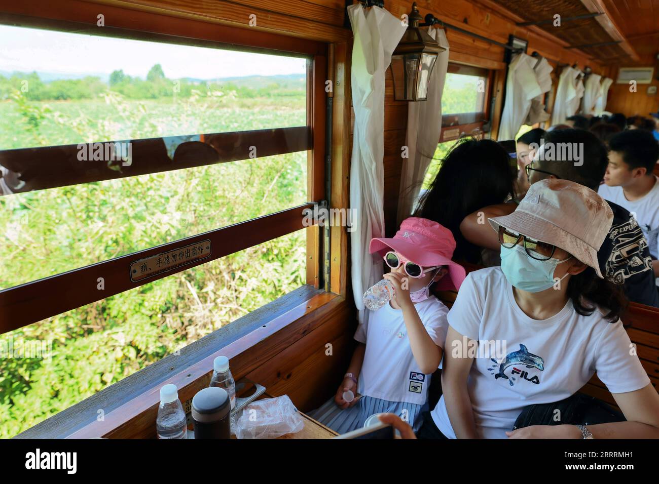 230604 -- HONGHE, June 4, 2023 -- People enjoy a sightseeing train ride ...