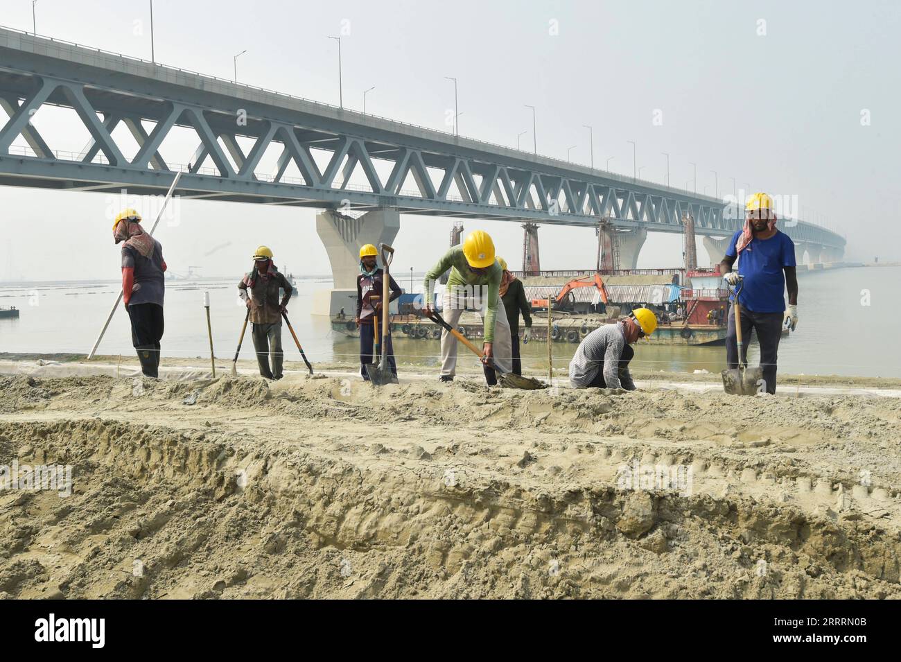 230606 -- DHAKA, June 6, 2023 -- Workers are pictured at a site of the ...