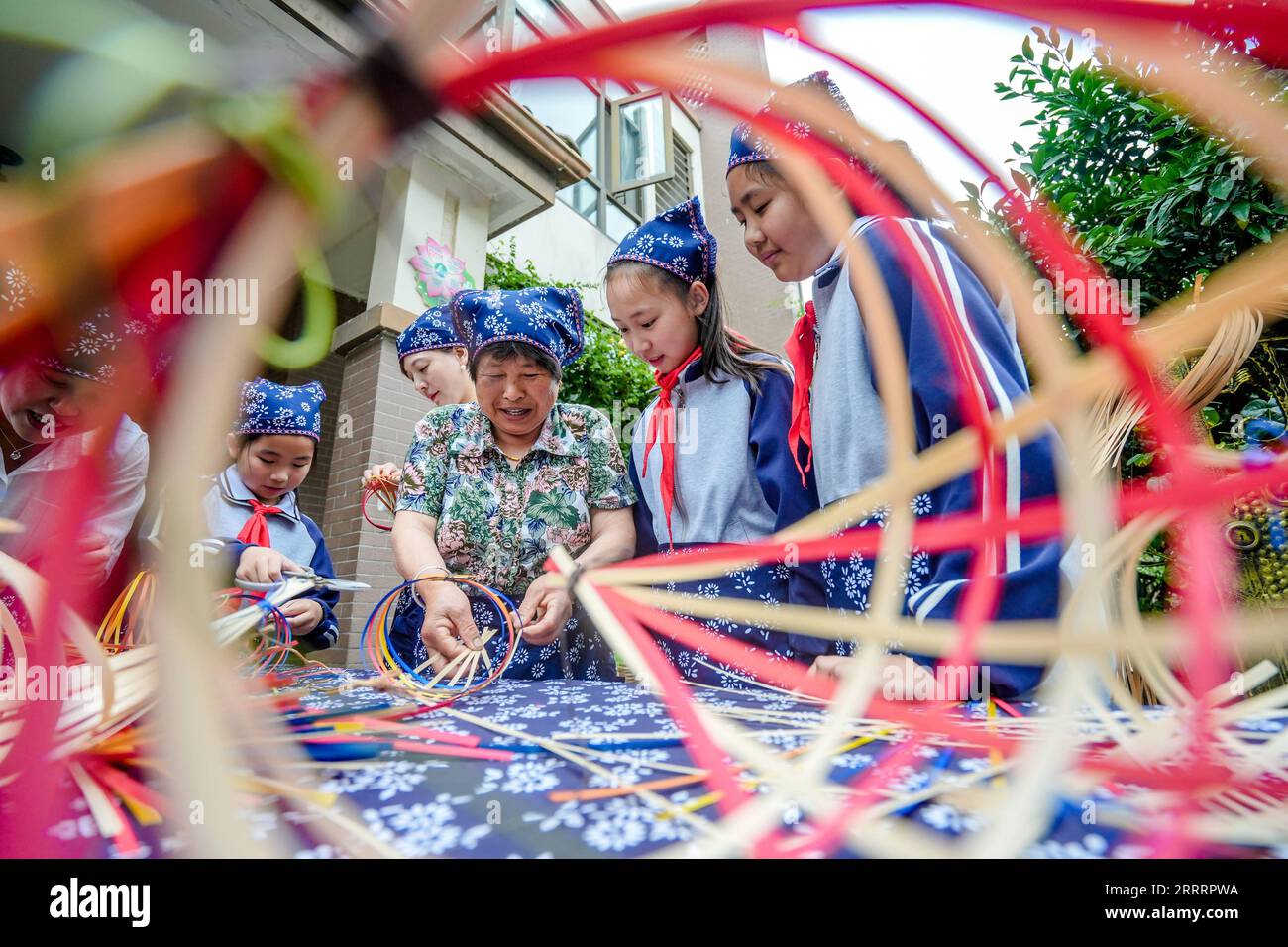 230610 -- HUZHOU, June 10, 2023 -- A bamboo weaver demonstrates weaving ...