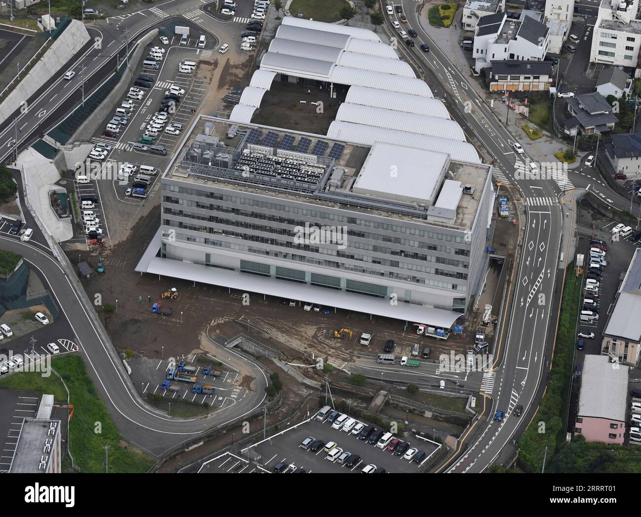 An aerial photo shows Hitachi City Hall building flooded with earth and ...