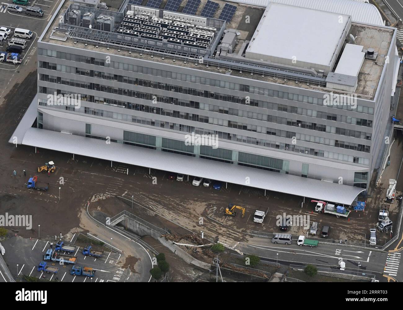 An aerial photo shows Hitachi City Hall building flooded with earth and ...