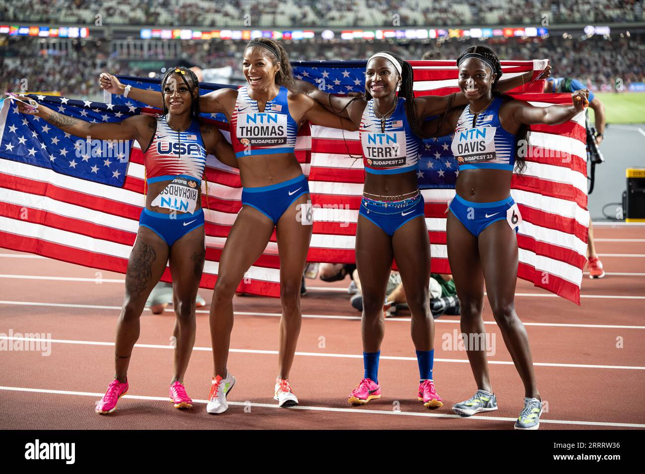 Gabrielle THOMAS, Sha'Carri Richardson,Twanisha TERRY,Tamari DAVISwith her flag in the 4x100 m ...