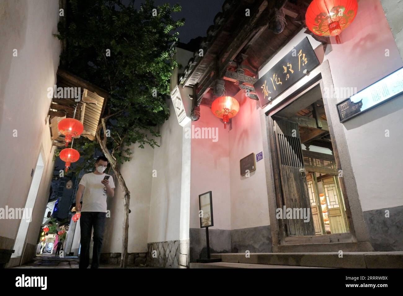 230615 -- FUZHOU, June 15, 2023 -- A tourist walks past the former ...