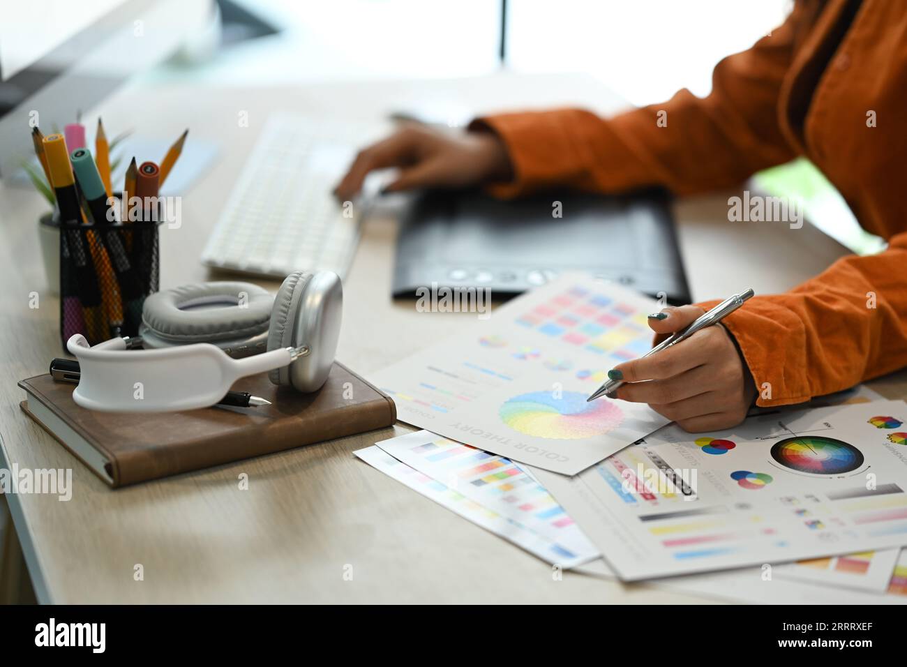 Cropped shot of creative woman working with color palette, choosing ...