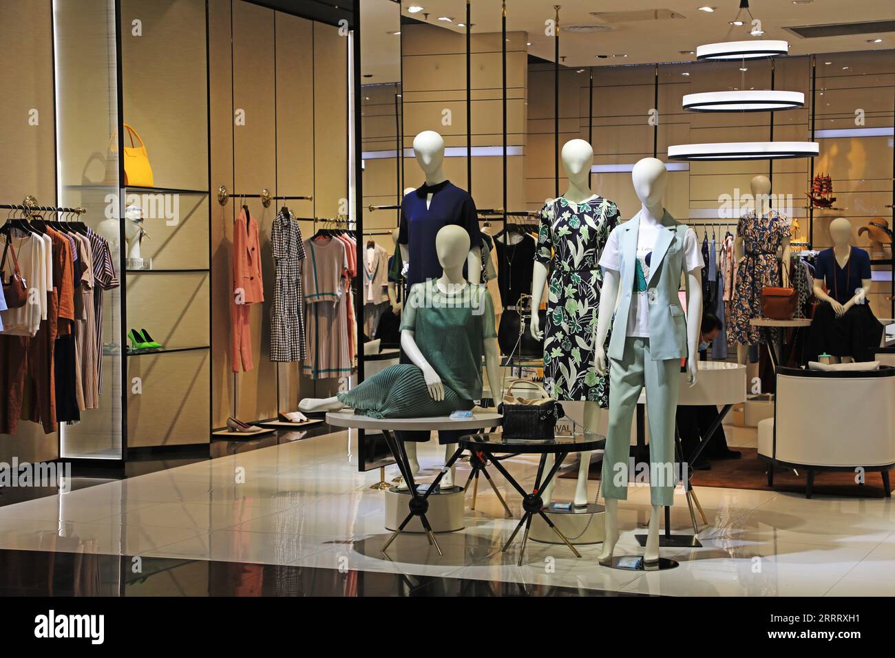 Models in the clothing store Stock Photo - Alamy