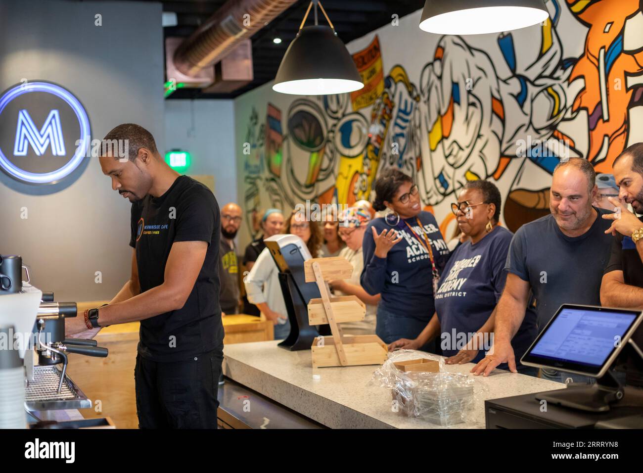 Detroit, Michigan - Jeffrey Lewis makes coffee as customers line up on ...