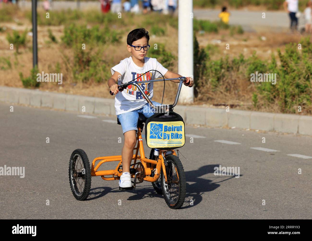 230619 -- BEIRUT, June 19, 2023 -- A boy enjoys riding a bike at the seaside in Beirut, Lebanon ...