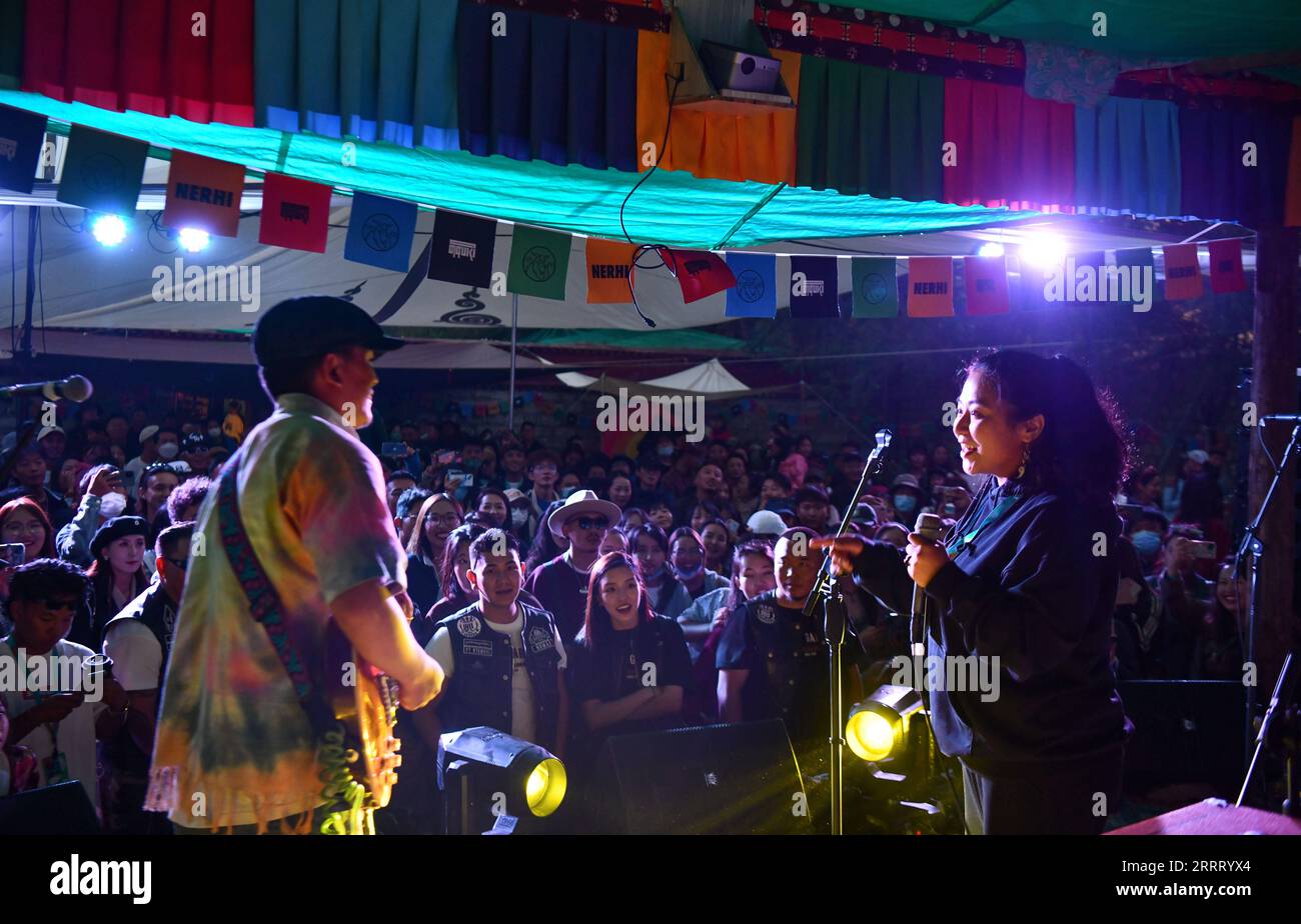 230619 -- LHASA, June 19, 2023 -- Youngsters attend a live concert in ...