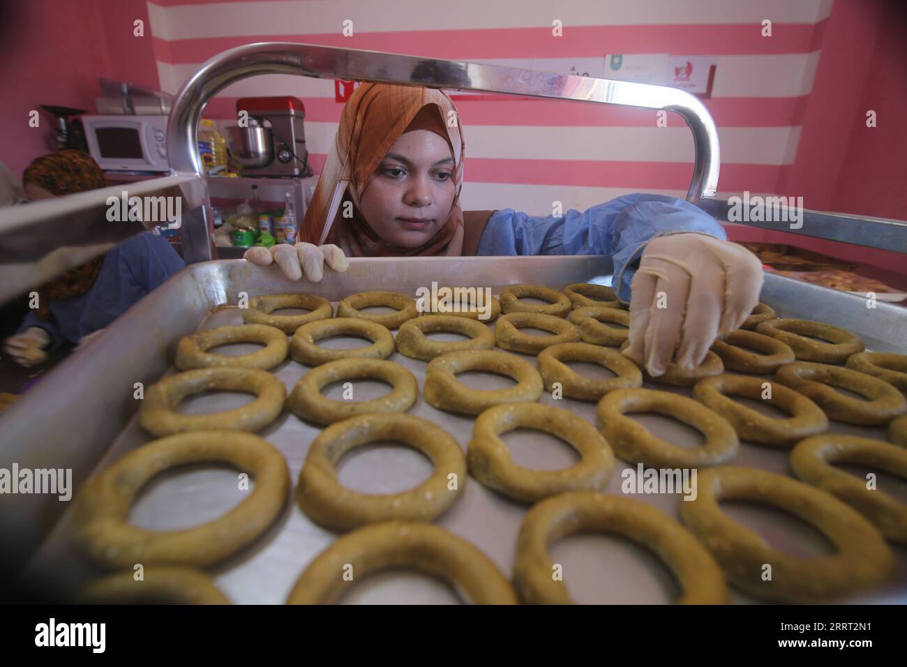 230626 -- GAZA, June 26, 2023 -- A Palestinian woman makes traditional ...