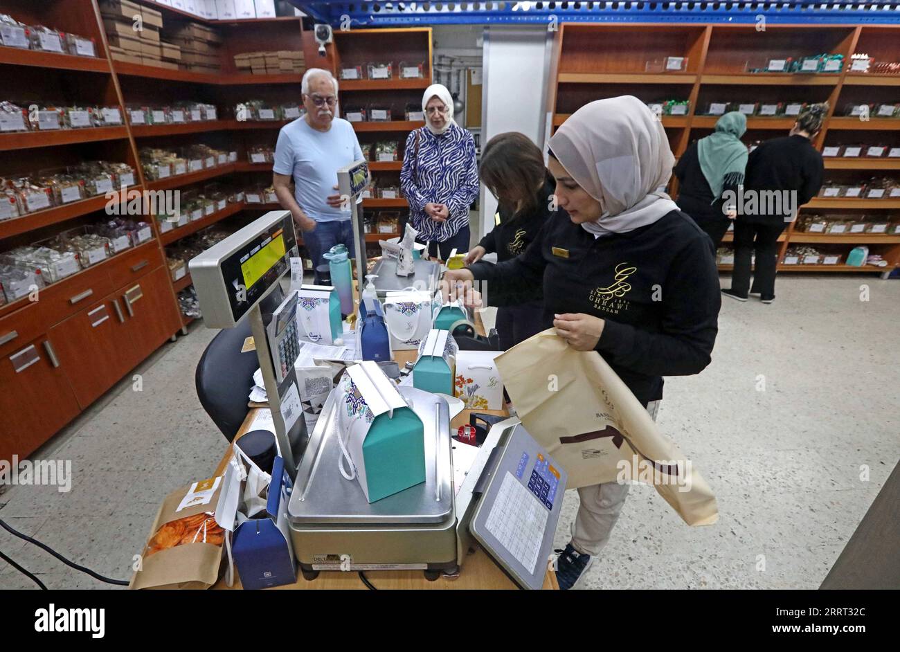 230626 -- BEIRUT, June 26, 2023 -- People buy gifts for Eid al-Adha in ...
