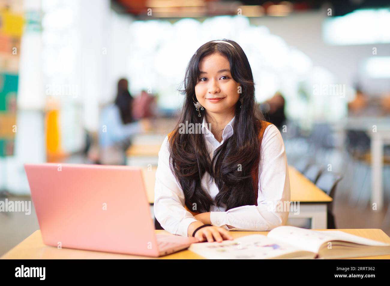 Asian girl with laptop in school. Student in classroom. Teenager in ...