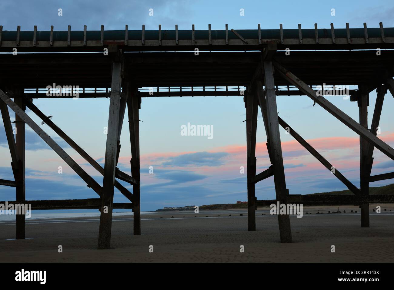 Derelict wooden pier on a beach at Hartlepool,County Durham, England ...