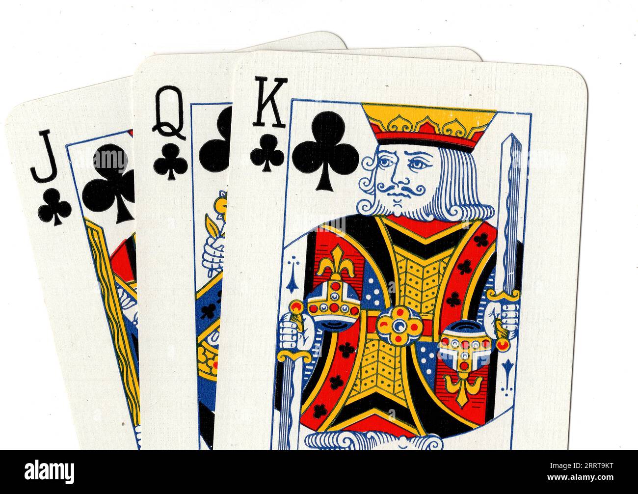 Vintage playing cards showing a jack, queen and king of clubss on a ...