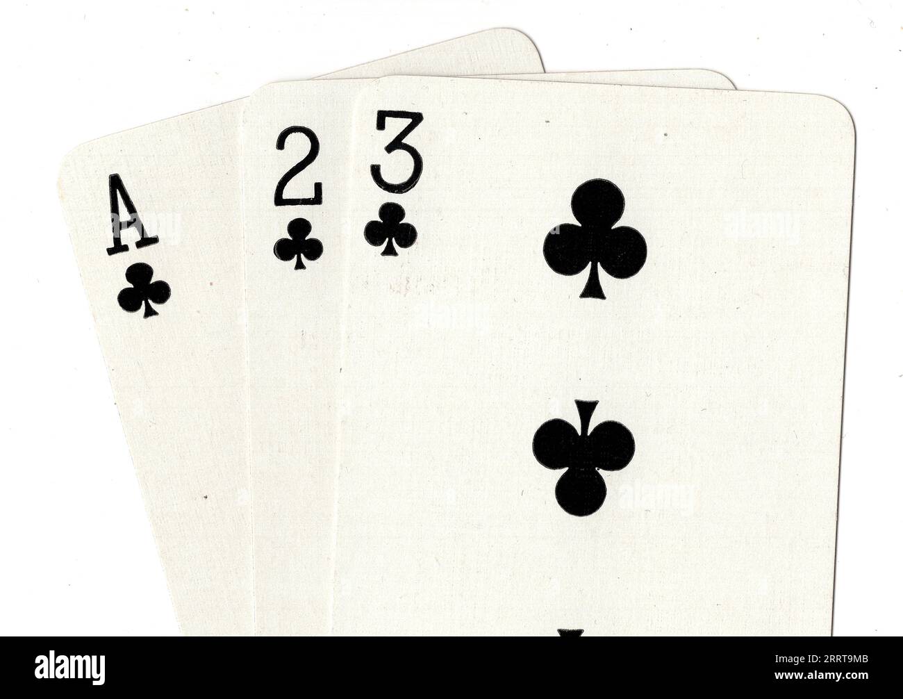 Vintage playing cards showing an ace, two and three of clubs on a white ...