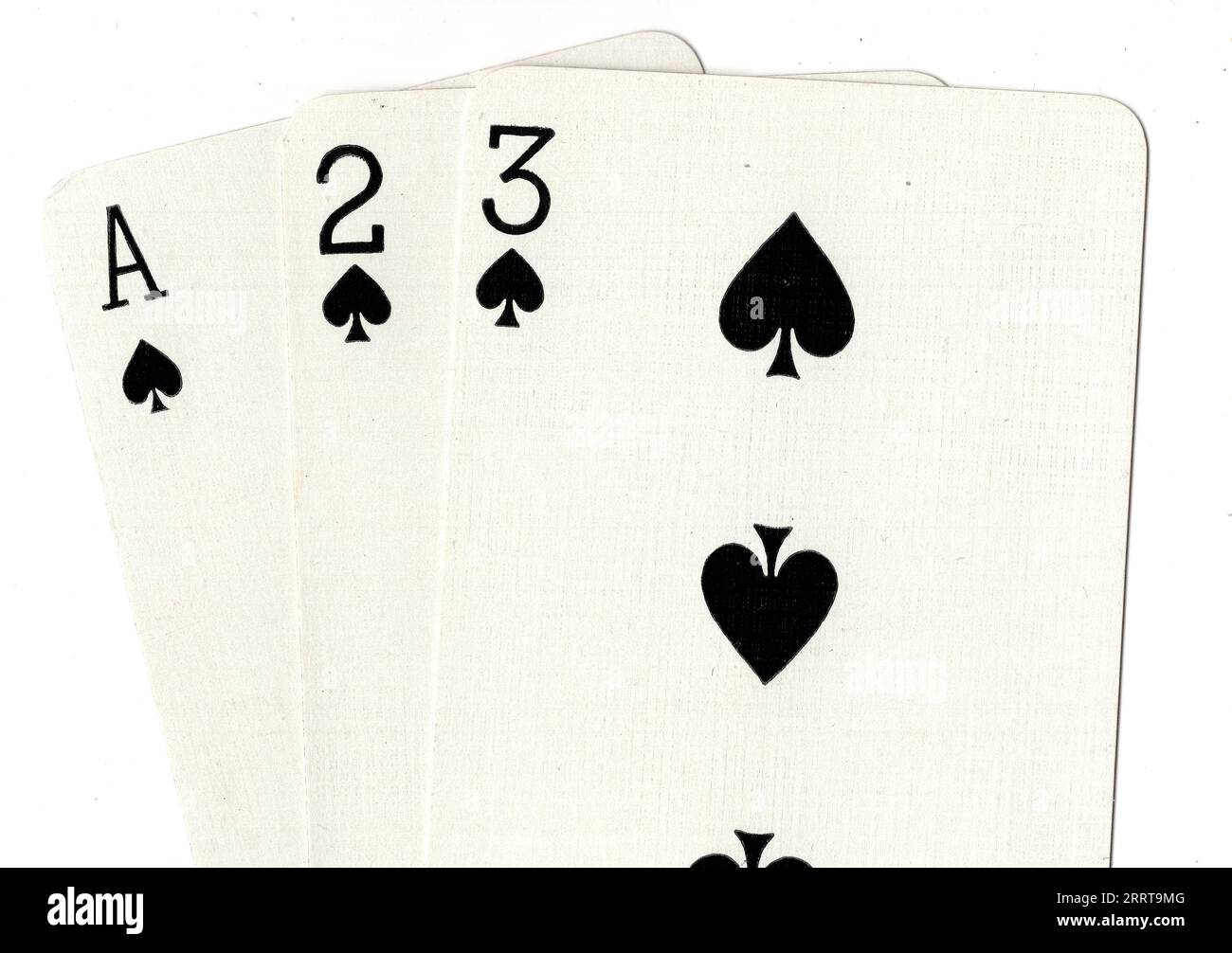 Vintage playing cards showing an ace, two and three of spades on a ...