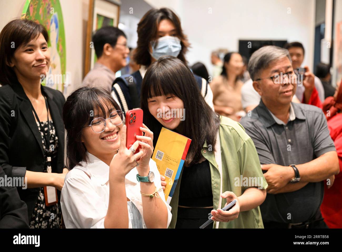 230712 -- KUALA LUMPUR, July 12, 2023 -- A visitor takes photos with ...