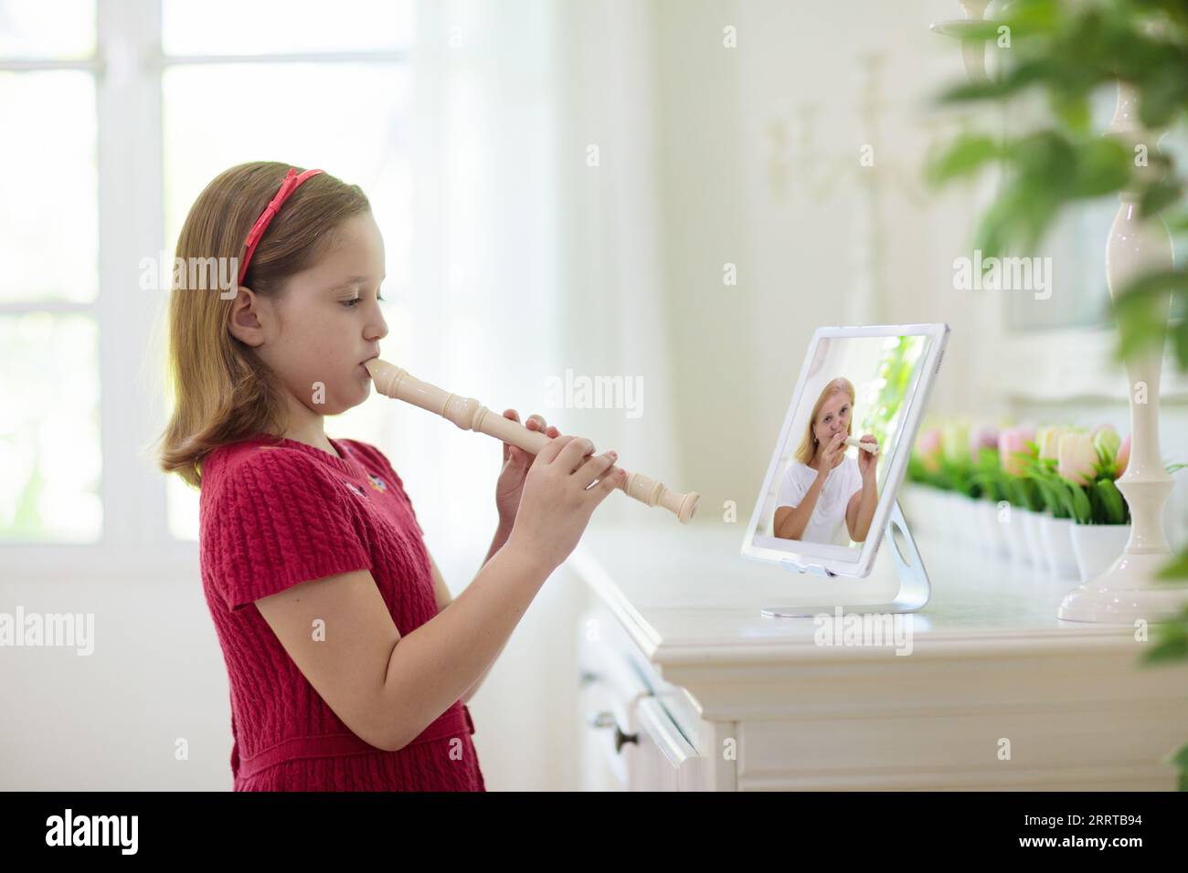 Girl playing recorder hi-res stock photography and images - Alamy