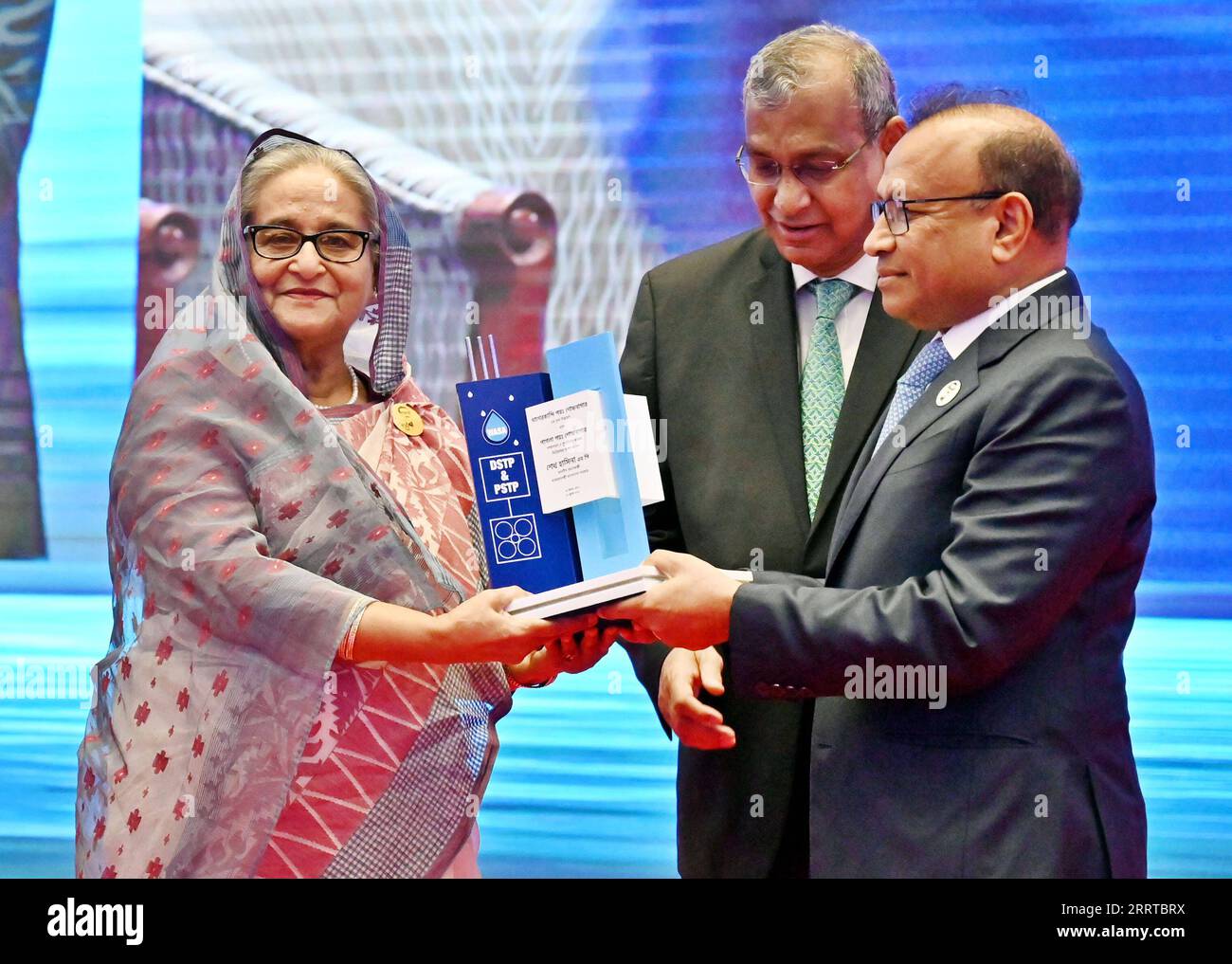 230714 -- DHAKA, July 14, 2023 -- Bangladeshi Prime Minister Sheikh Hasina L receives a memento ...