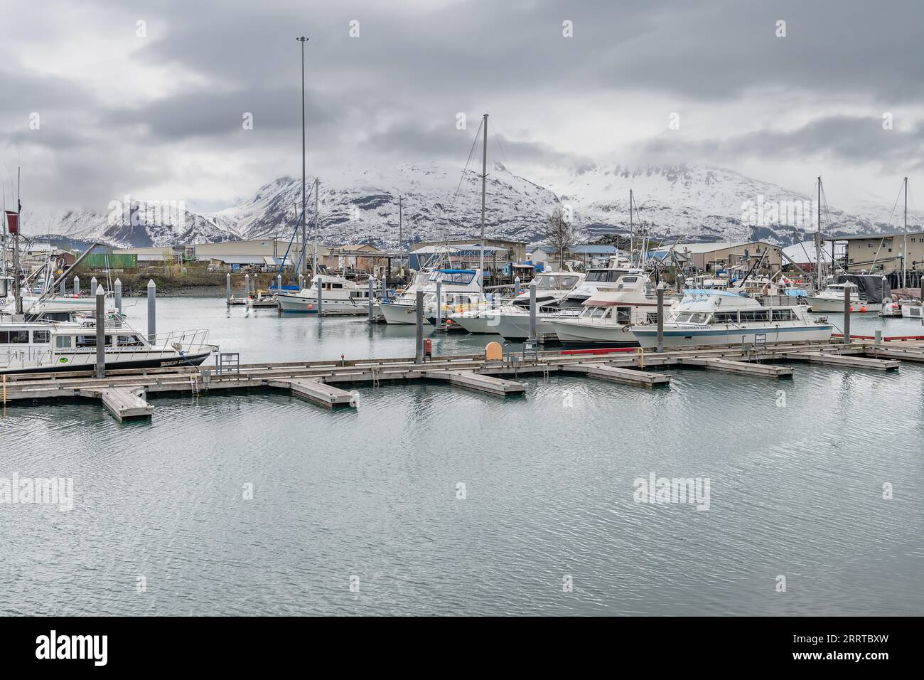 Valdez marina with snow and cloud covered mountains behind, Valdez ...