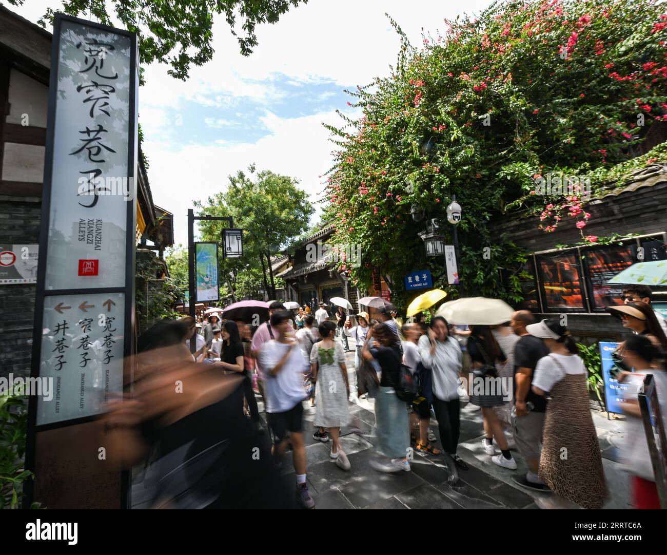230715 -- CHENGDU, July 15, 2023 -- Tourists visit the Kuanzhai Alley ...