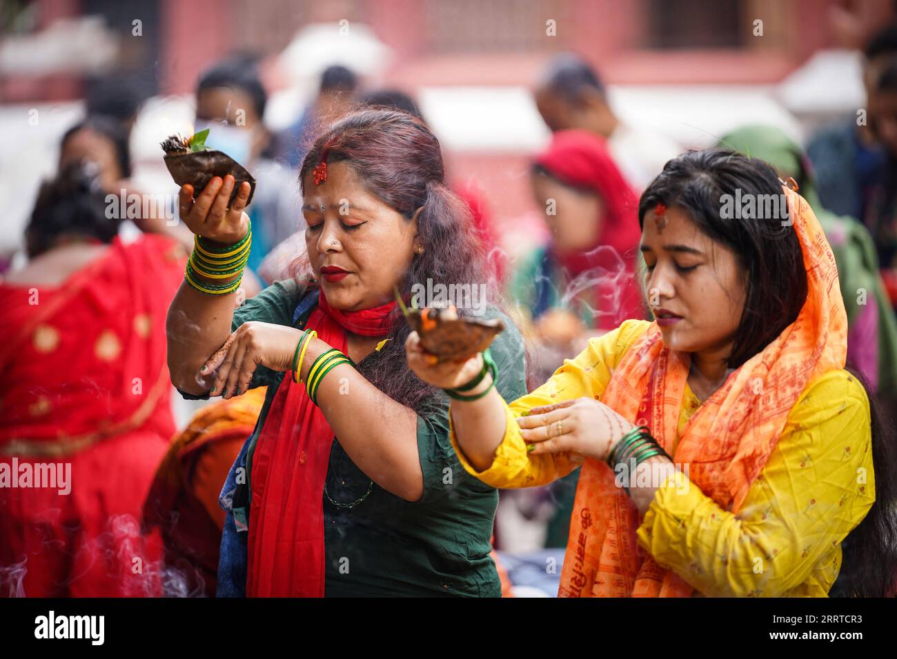 230717 -- LALITPUR, July 17, 2023 -- Devotees pray on the first Monday ...