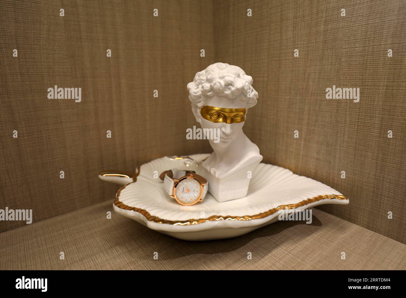 Ceramic figures and works of art in the shape of watches Stock Photo ...