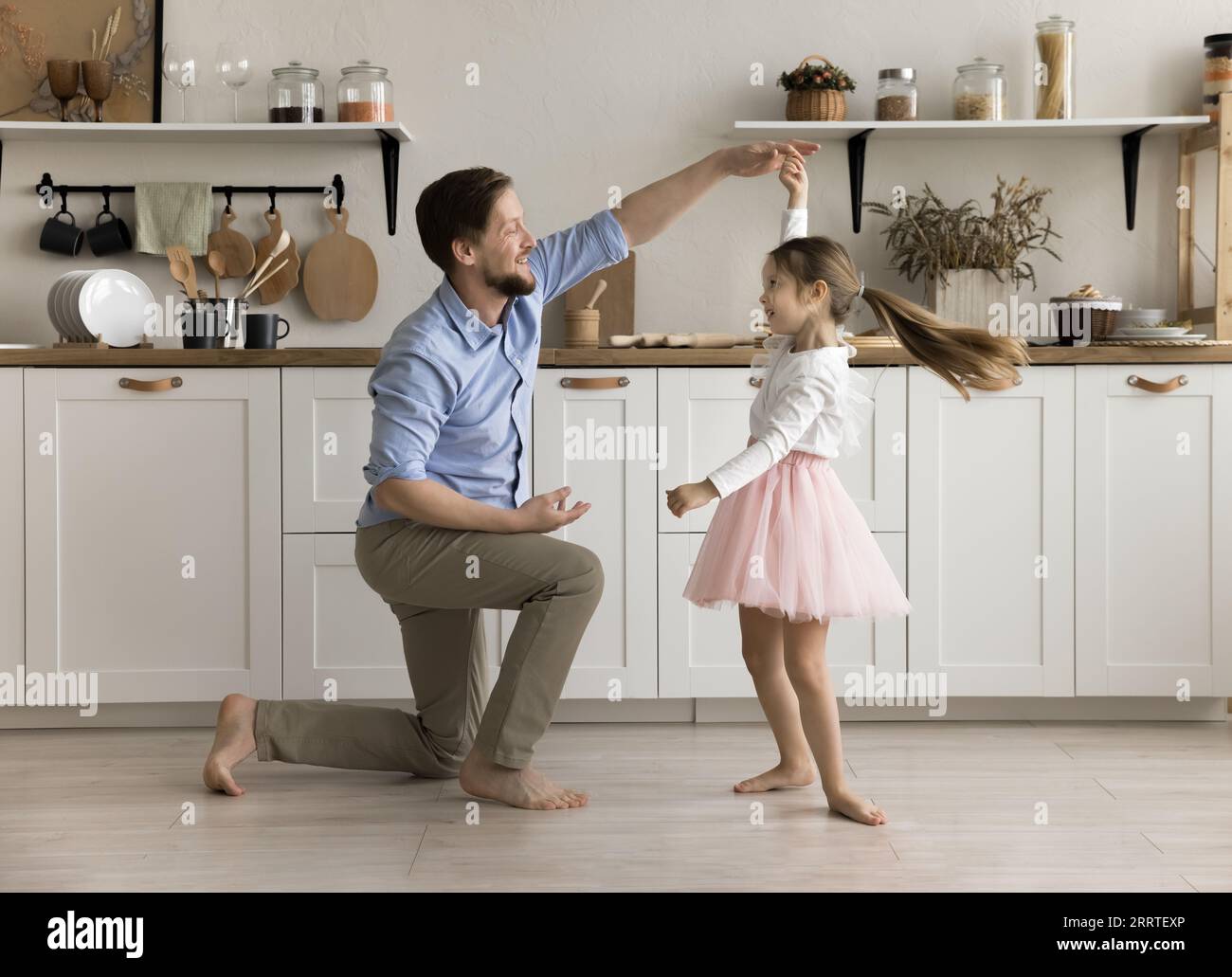 Happy loving daddy dancing with little princess daughter kid Stock ...