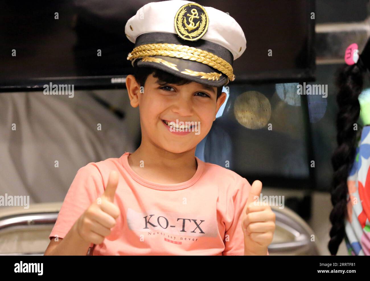 230722 -- BAGHDAD, July 22, 2023 -- A boy takes a river taxi in Baghdad ...