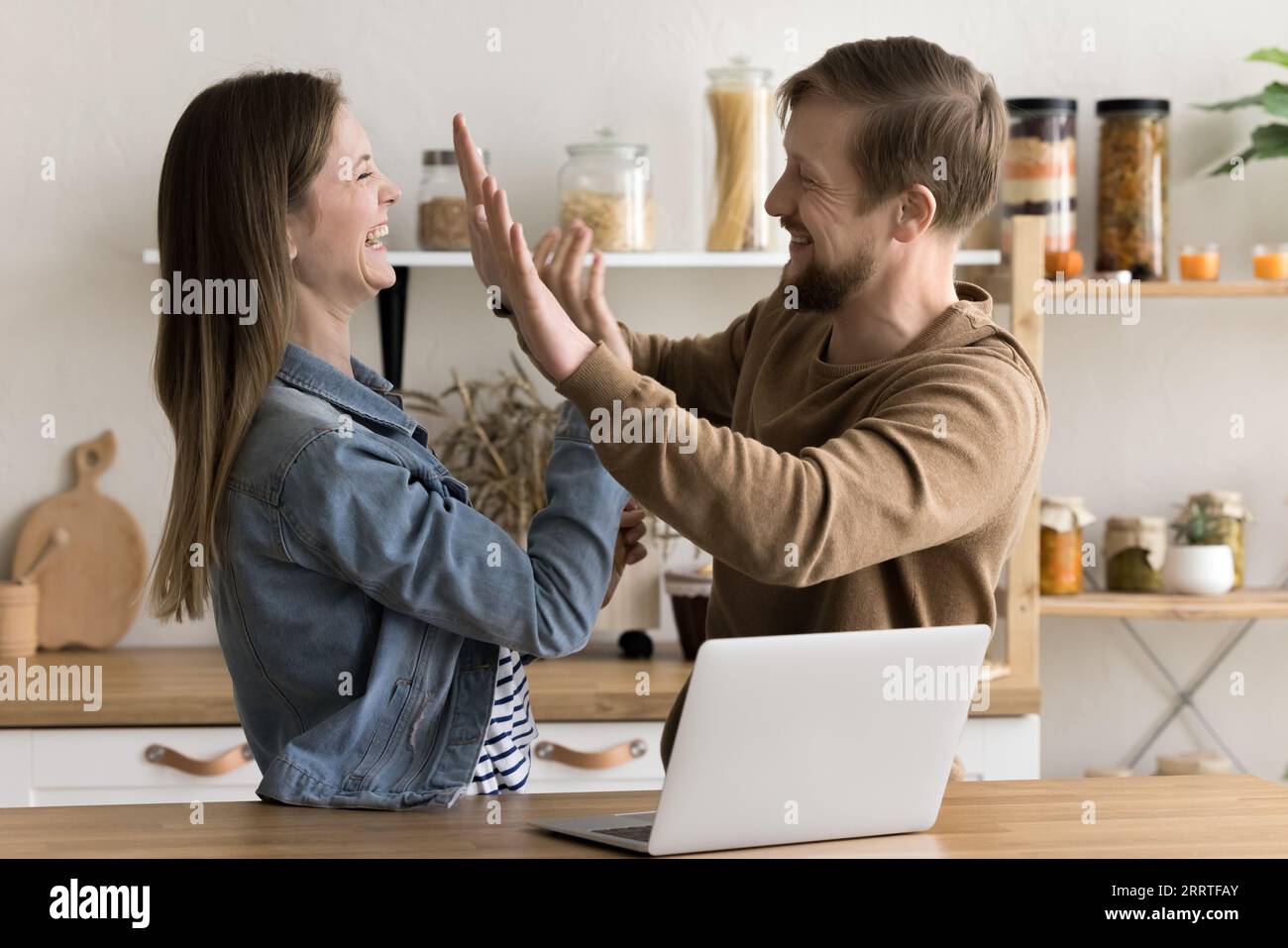 Family celebrating indoors young hi-res stock photography and images ...