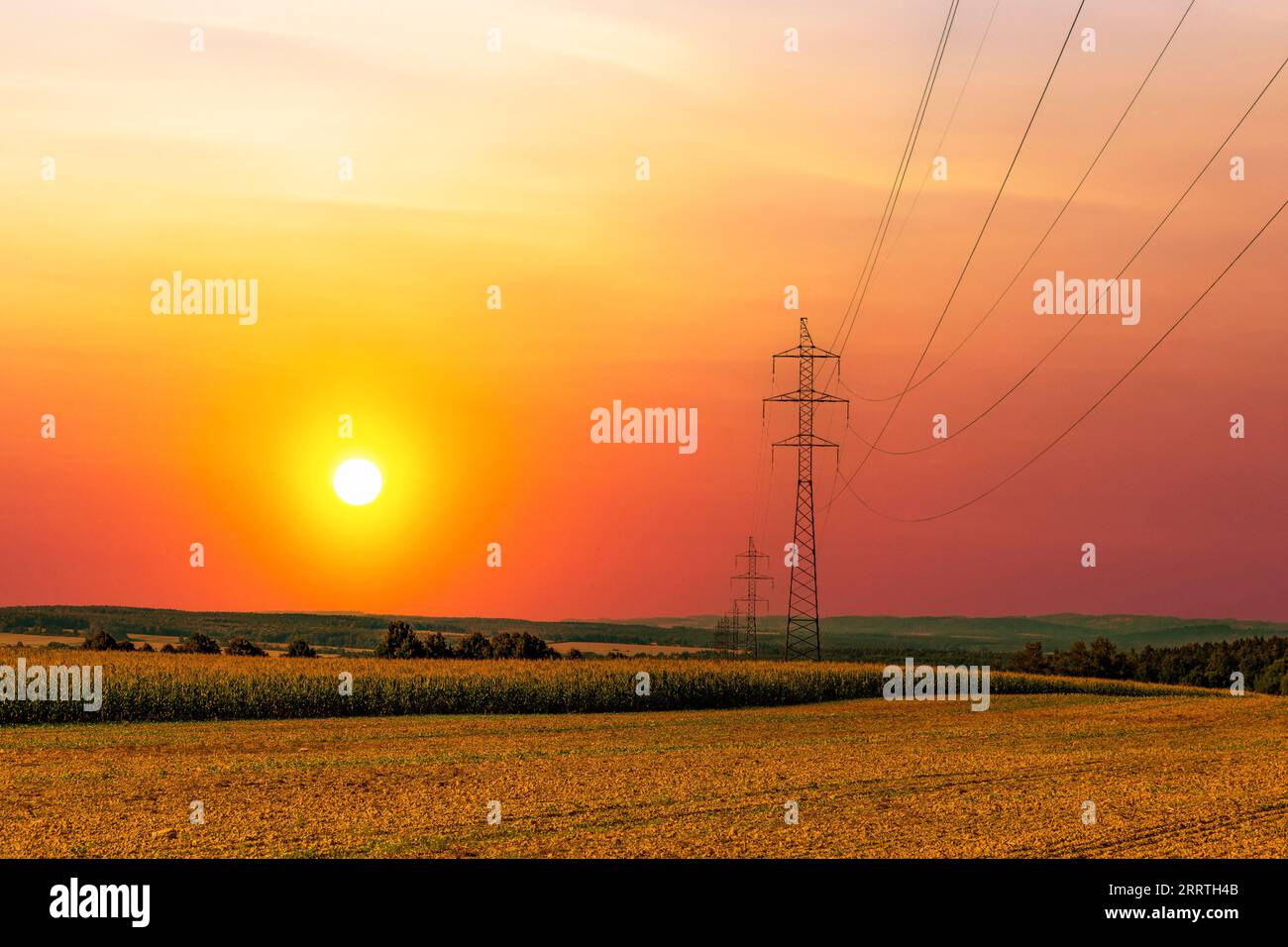 High voltage electric transmission lines. Sunset time Stock Photo - Alamy