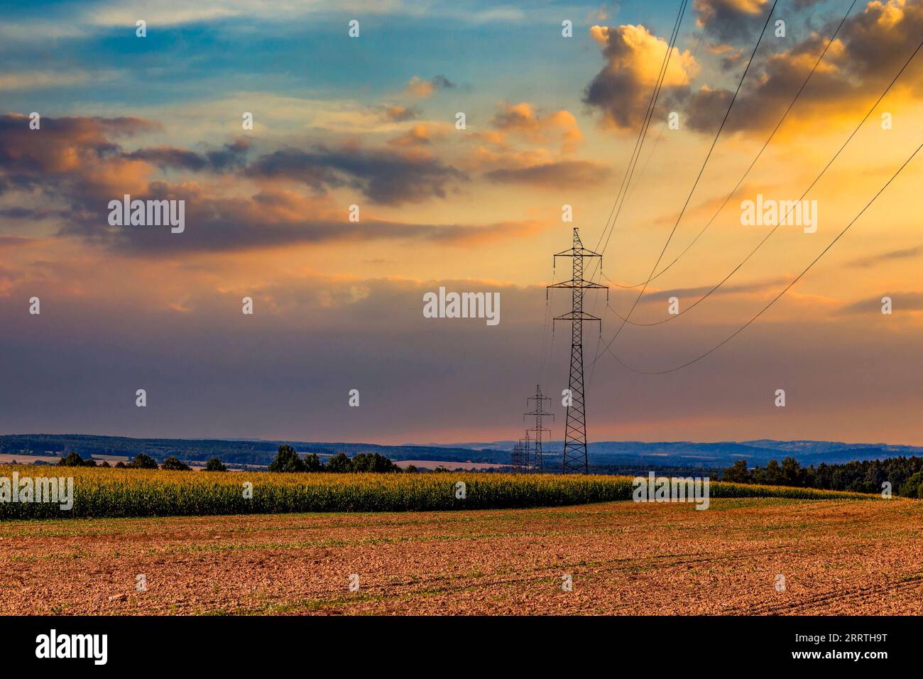 High voltage electric transmission lines. Sunset time Stock Photo - Alamy