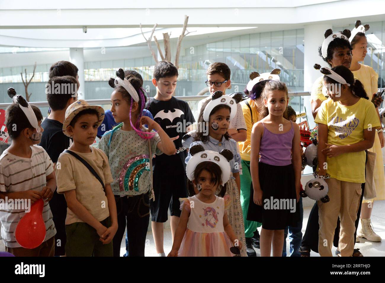 230727 -- DOHA, July 27, 2023 -- People visit Qatar Panda House in Al ...