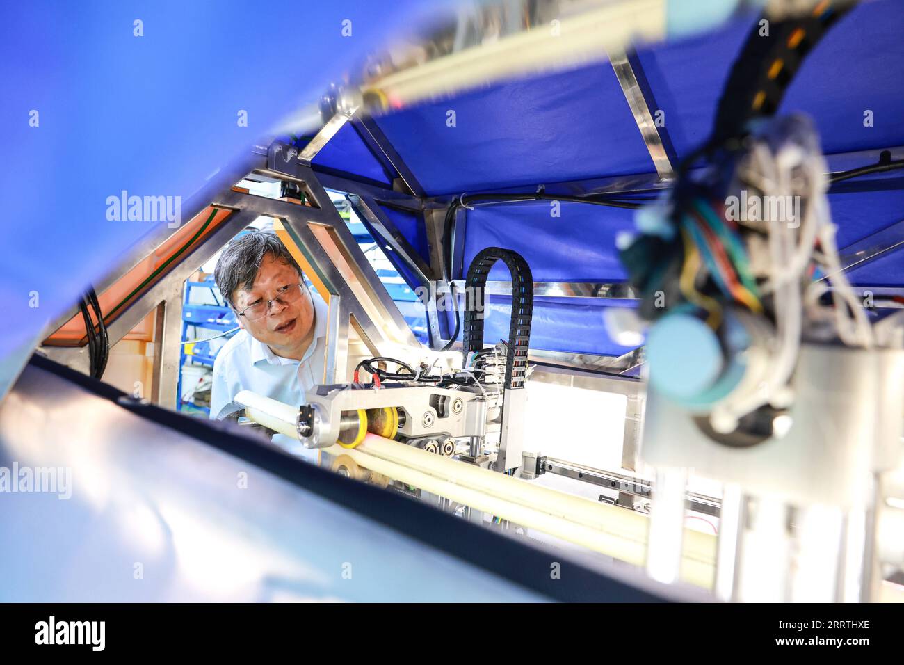 230727 -- PINGTANG, July 27, 2023 -- A staff member checks a ...