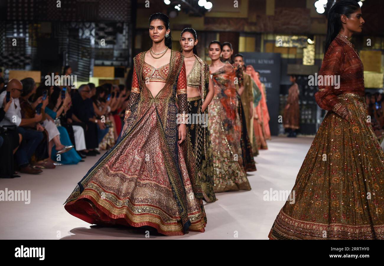 230727 -- NEW DELHI, July 27, 2023 -- Models display creations by ...