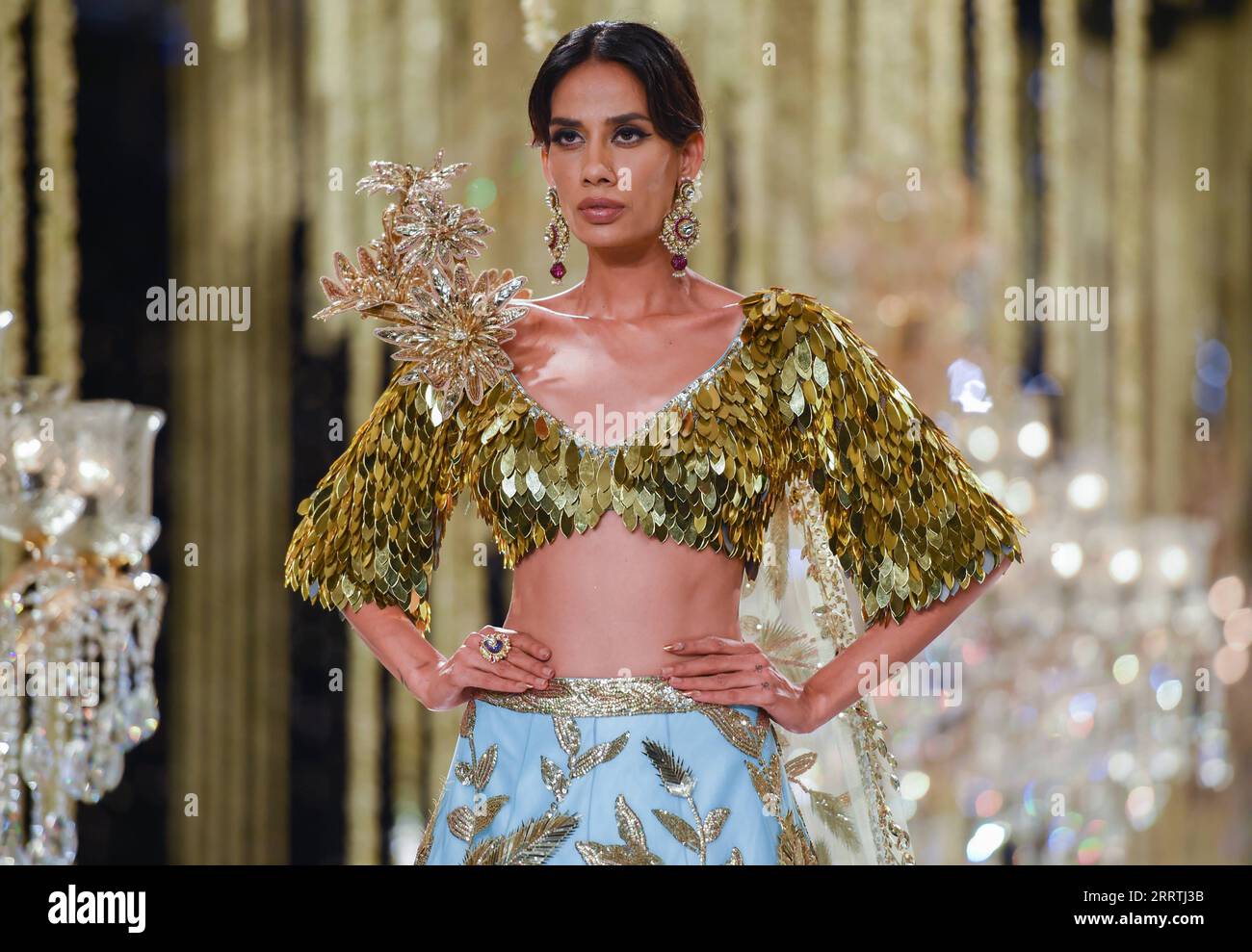 230727 -- NEW DELHI, July 27, 2023 -- A model displays a creation by ...