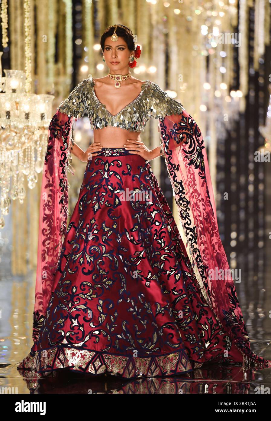 230727 -- NEW DELHI, July 27, 2023 -- A model displays a creation by ...