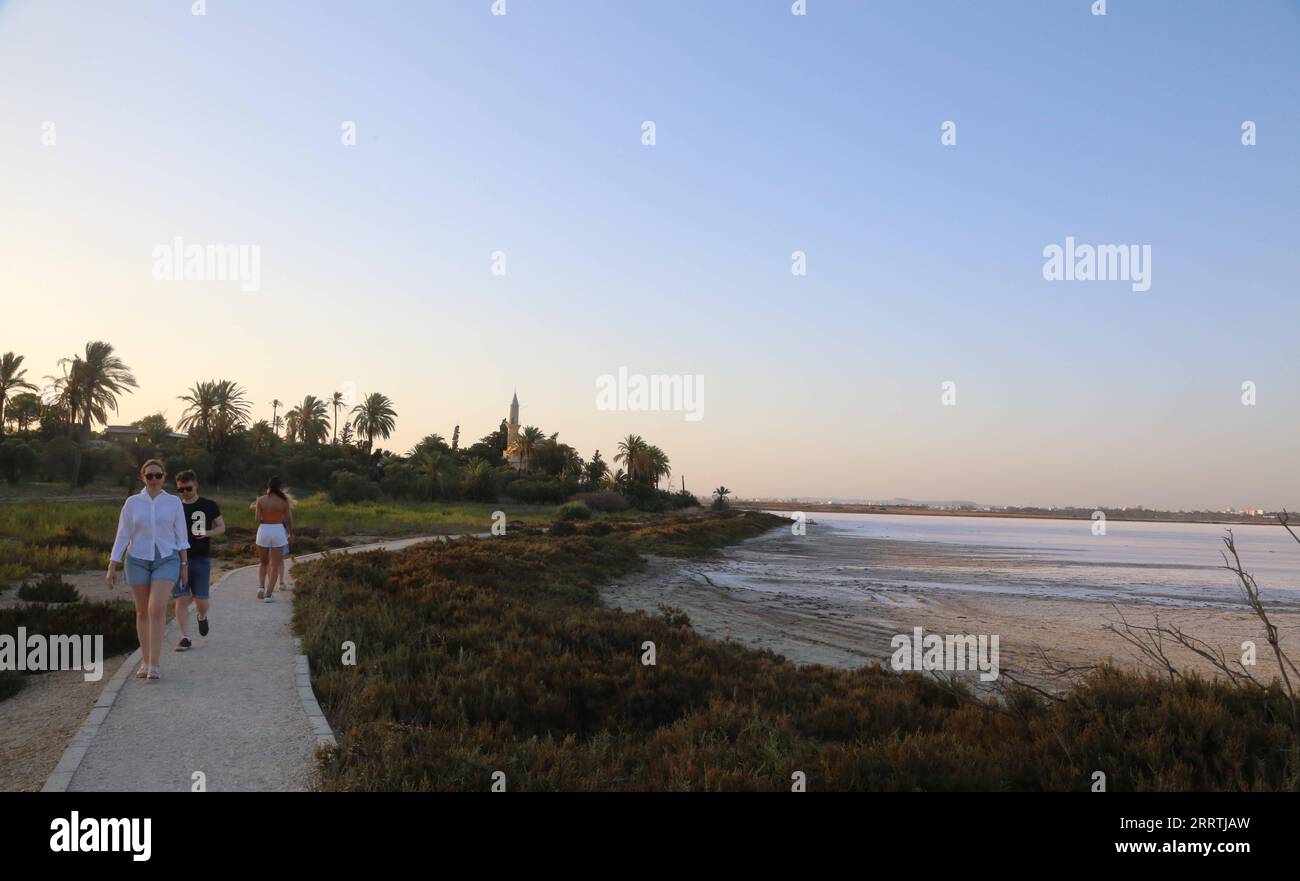 230728 -- LARNACA, July 28, 2023 -- People visit Larnaca Salt Lake in ...