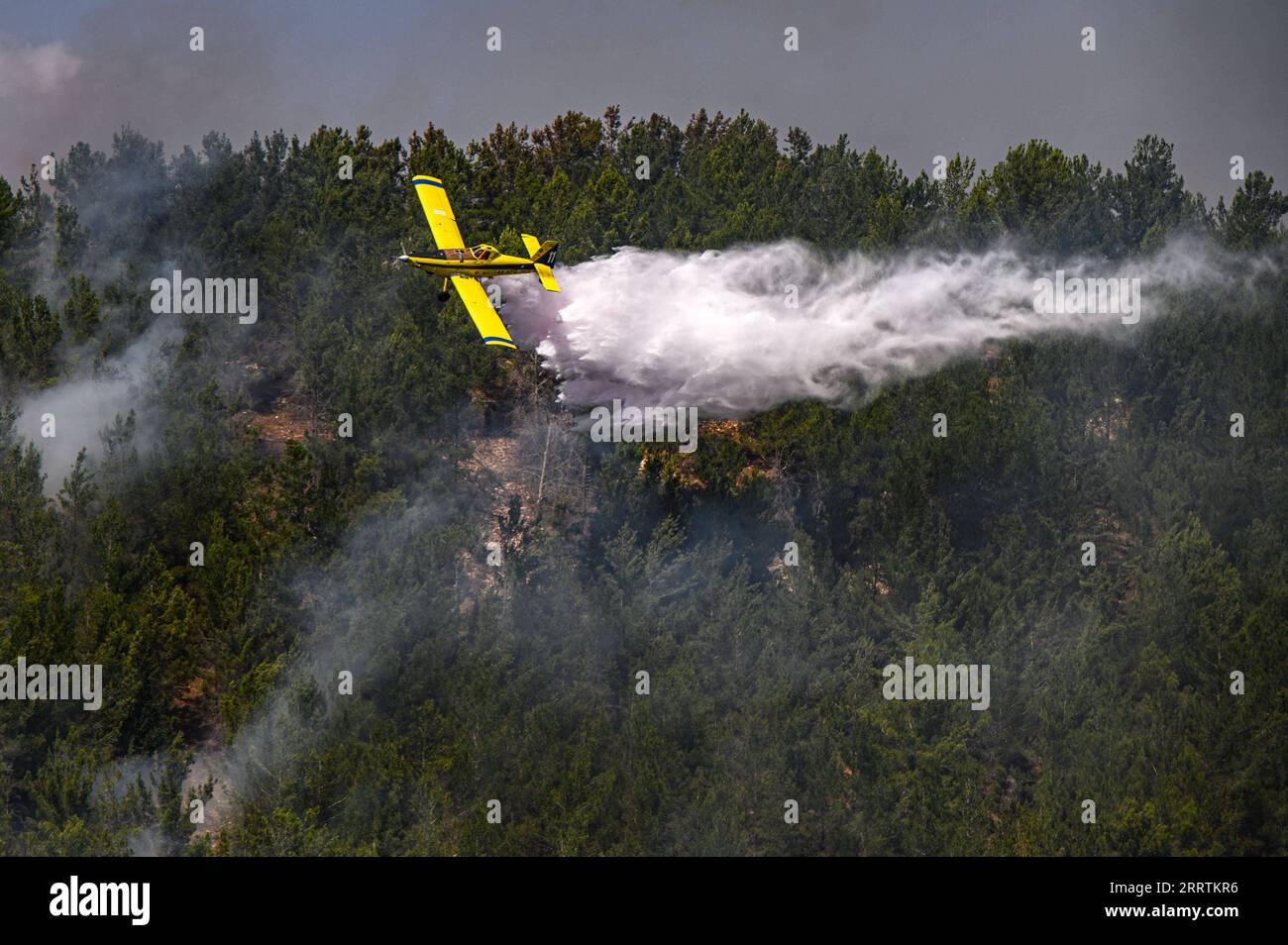 230730 -- JISH, July 30, 2023 -- A firefighting plane flies to ...