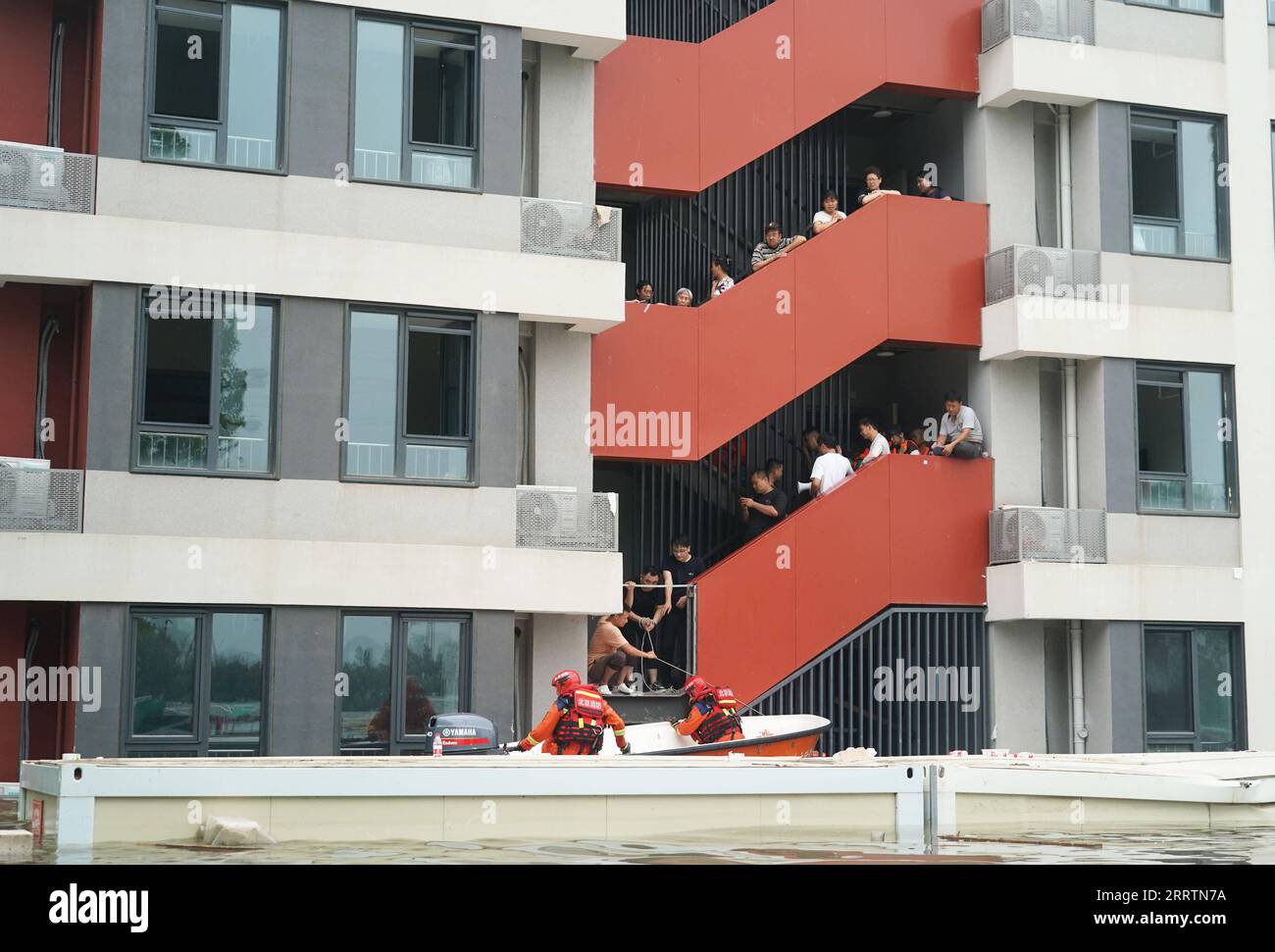 230802 -- BEIJING, Aug. 2, 2023 -- Firefighters drive a rescue boat to ...
