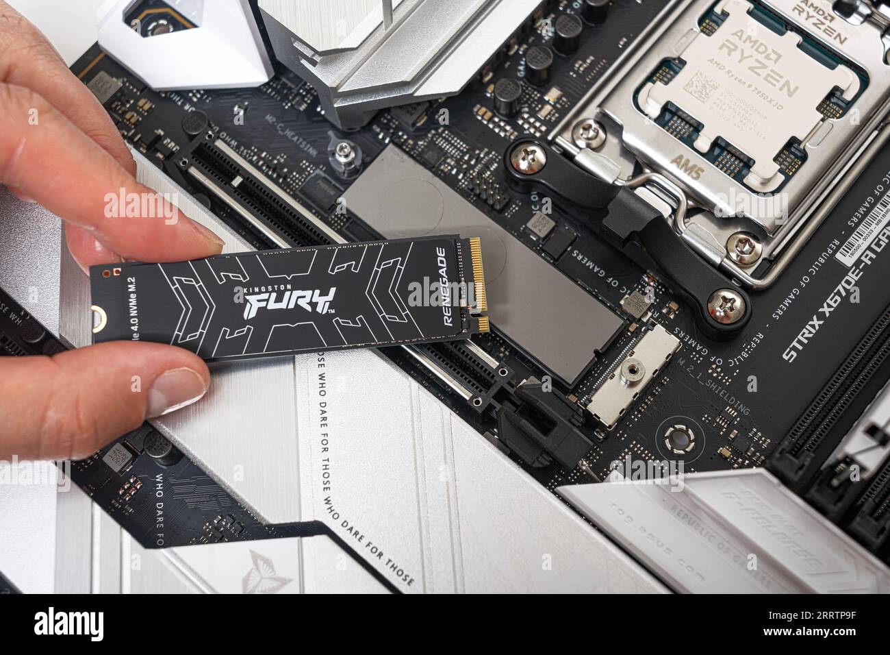 Installing an M2 SSD Kingston FURY Renegade on a PC motherboard during ...