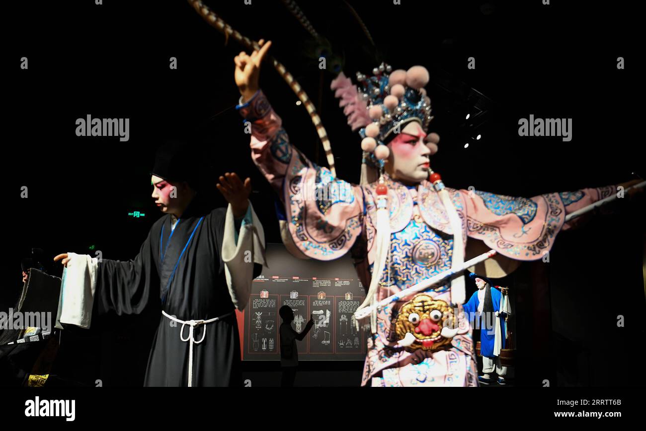 230809 -- XI AN, Aug. 9, 2023 -- A tourist visits an exhibition at a ...