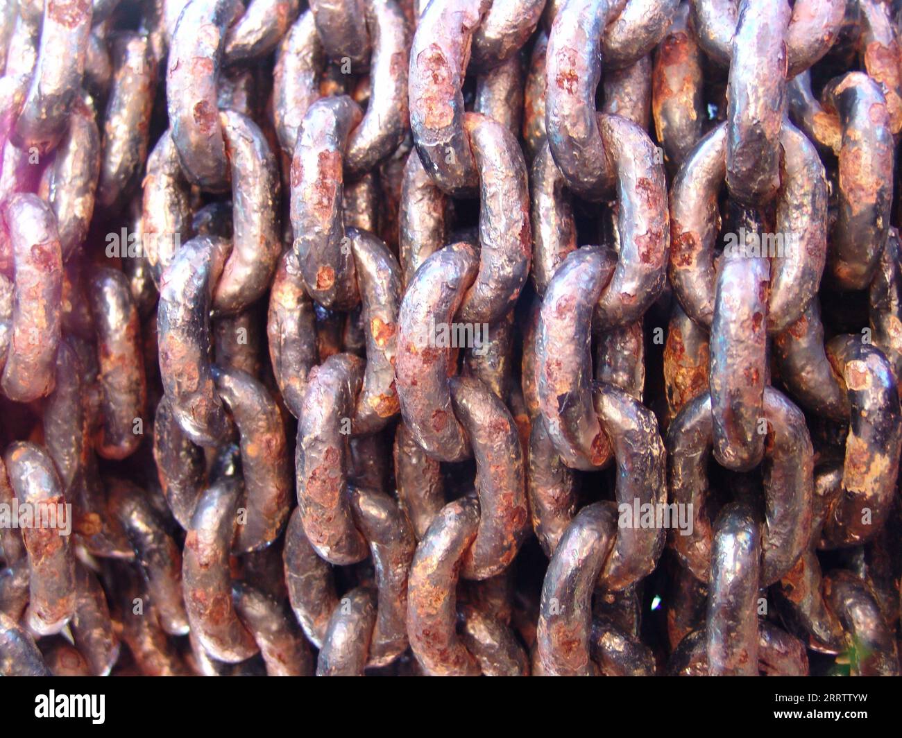 An old anchor chain was discovered on a large old sailboat in a marina ...